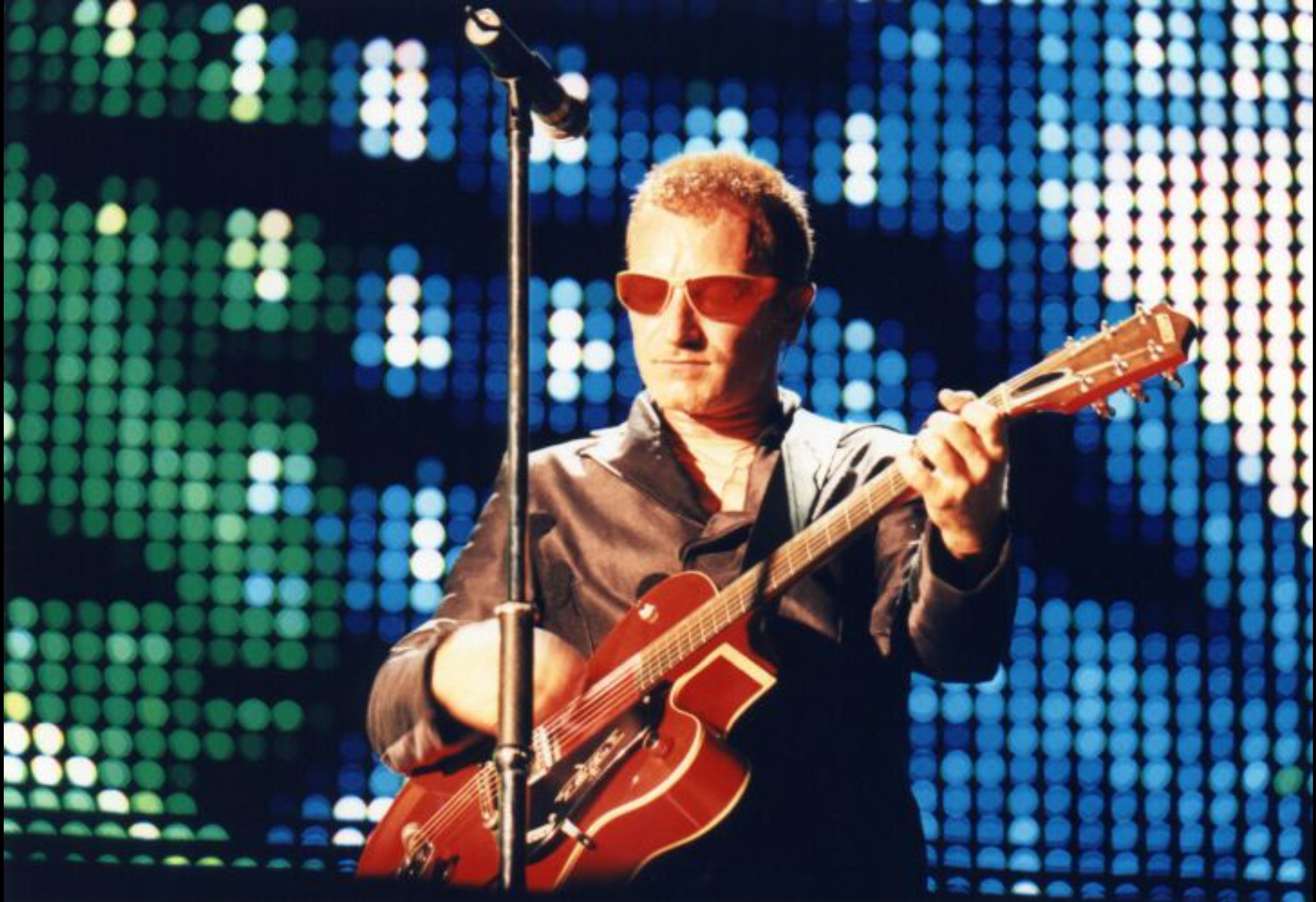 U2start.com | Photos | Bono Playing Guitar, Live In Tel Aviv 1997
